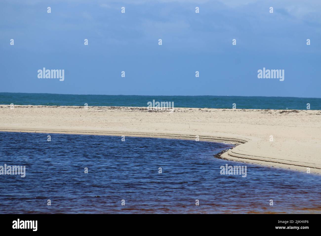 A rocky hill with a sandy beach by the Moore River, Guilderton, Western ...