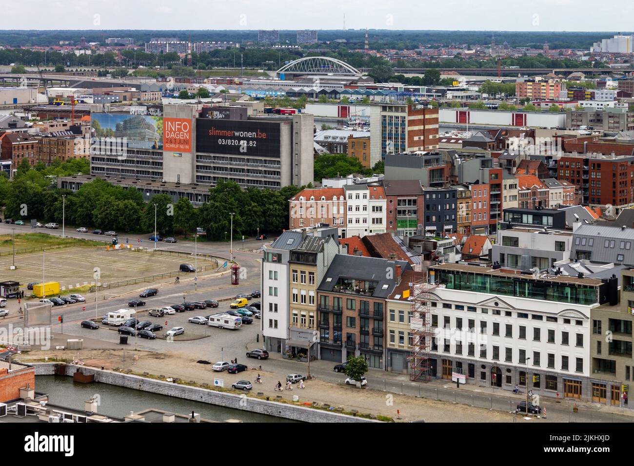 The docks on Scheldt river and the historical buildings of Antwerp ...