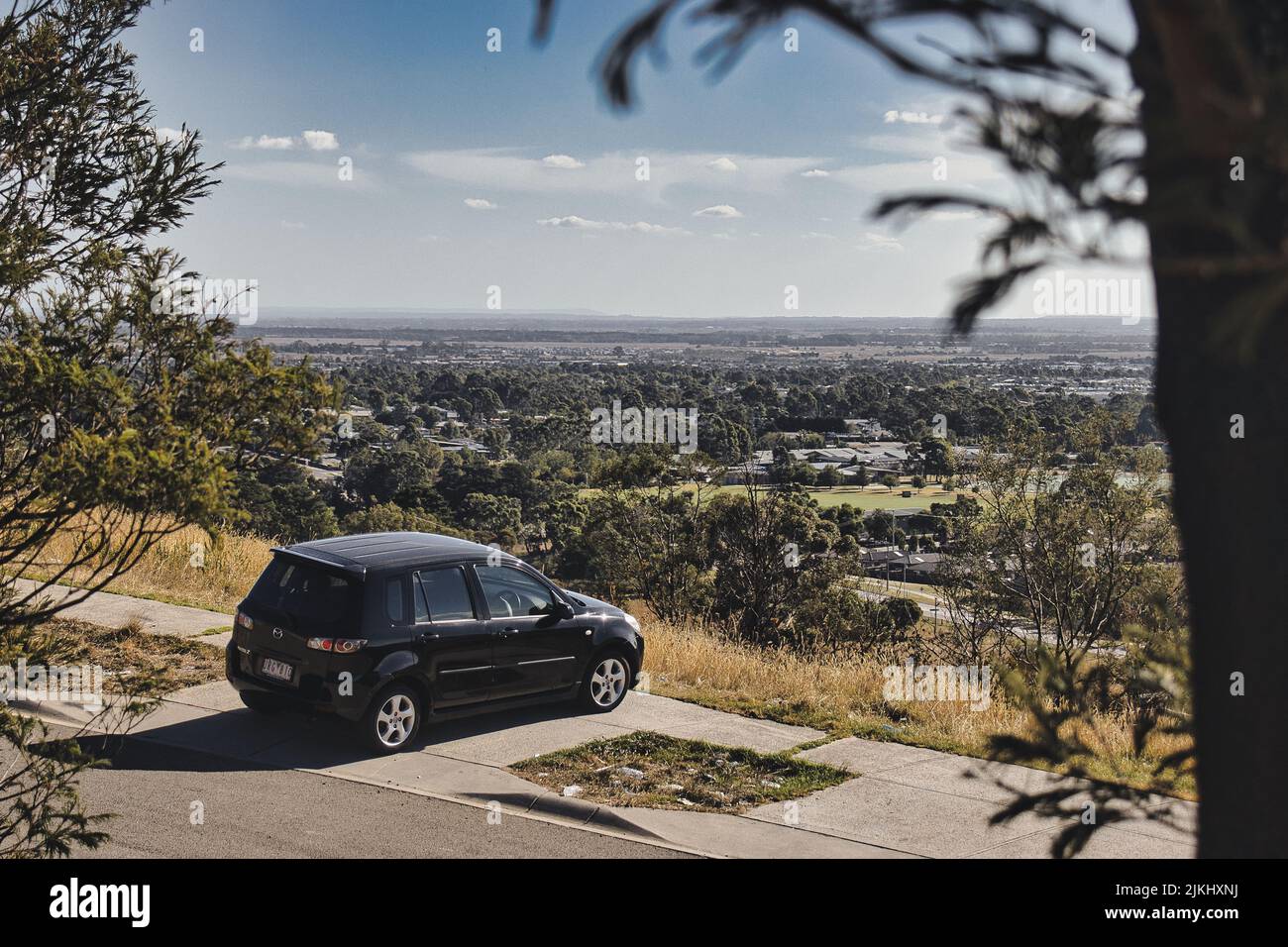A car parked on the side of a hill Stock Photo - Alamy