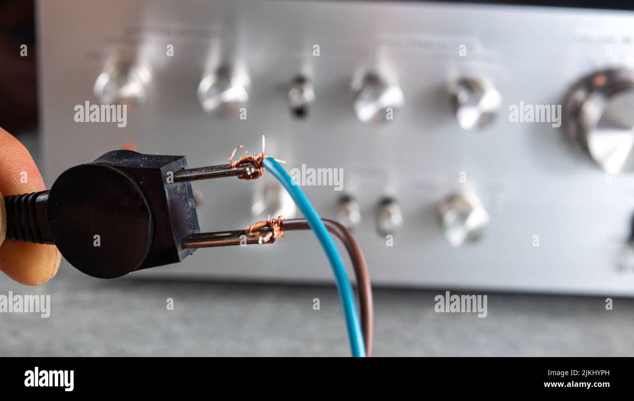 homemade adapter with an American electric plug Stock Photo - Alamy