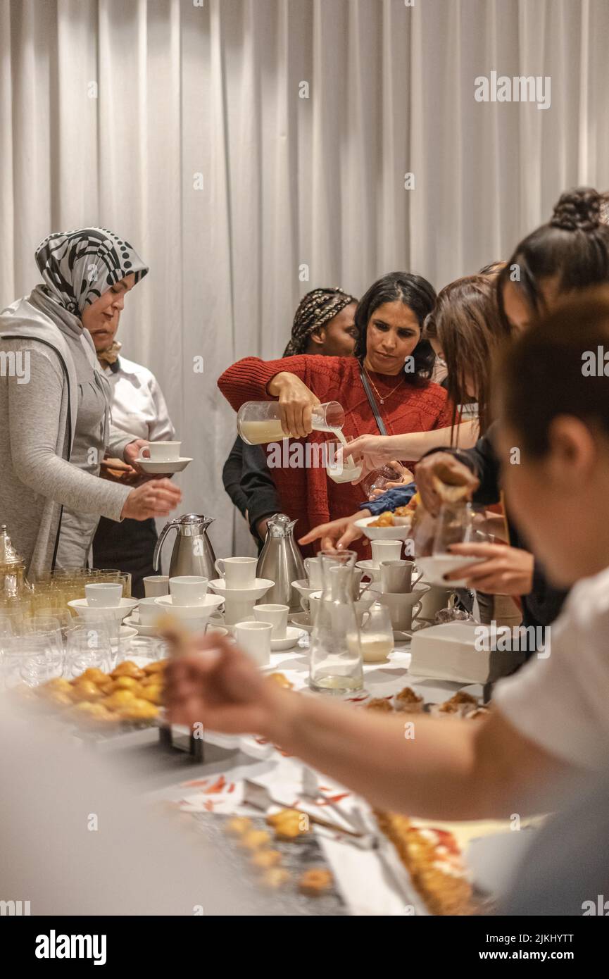 Group of women celebrating Women's day together indoors Stock Photo - Alamy