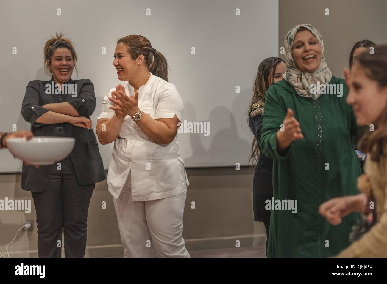 Group of women celebrating Women's day together indoors Stock Photo - Alamy
