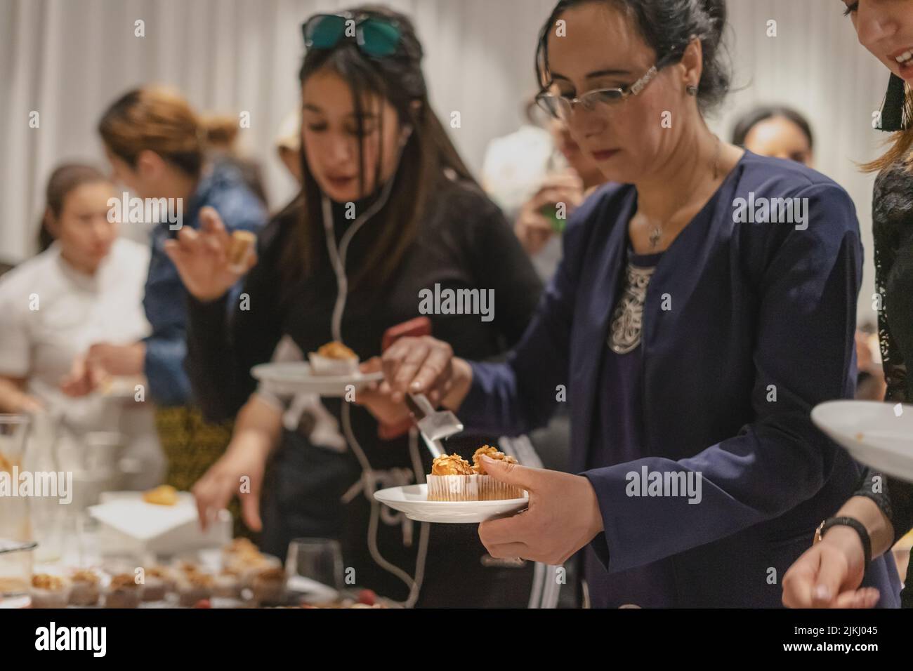 Group of women celebrating Women's day together indoors Stock Photo - Alamy