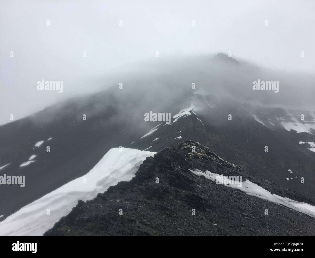 Floating mist over Nigel Peak Summit Ridge in Jasper National Park ...