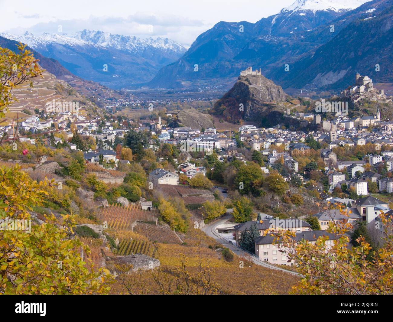 An aerial view of the skyline through trees in Sion, Switzerland Stock ...
