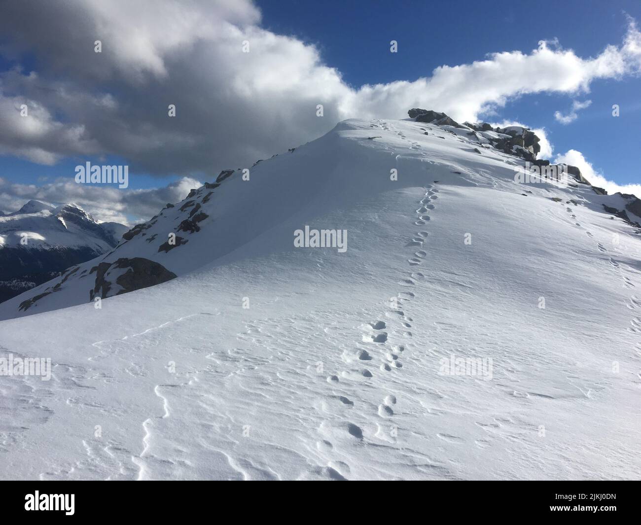 A low angle shot of the snowy Bald Hills in Jasper National Park ...