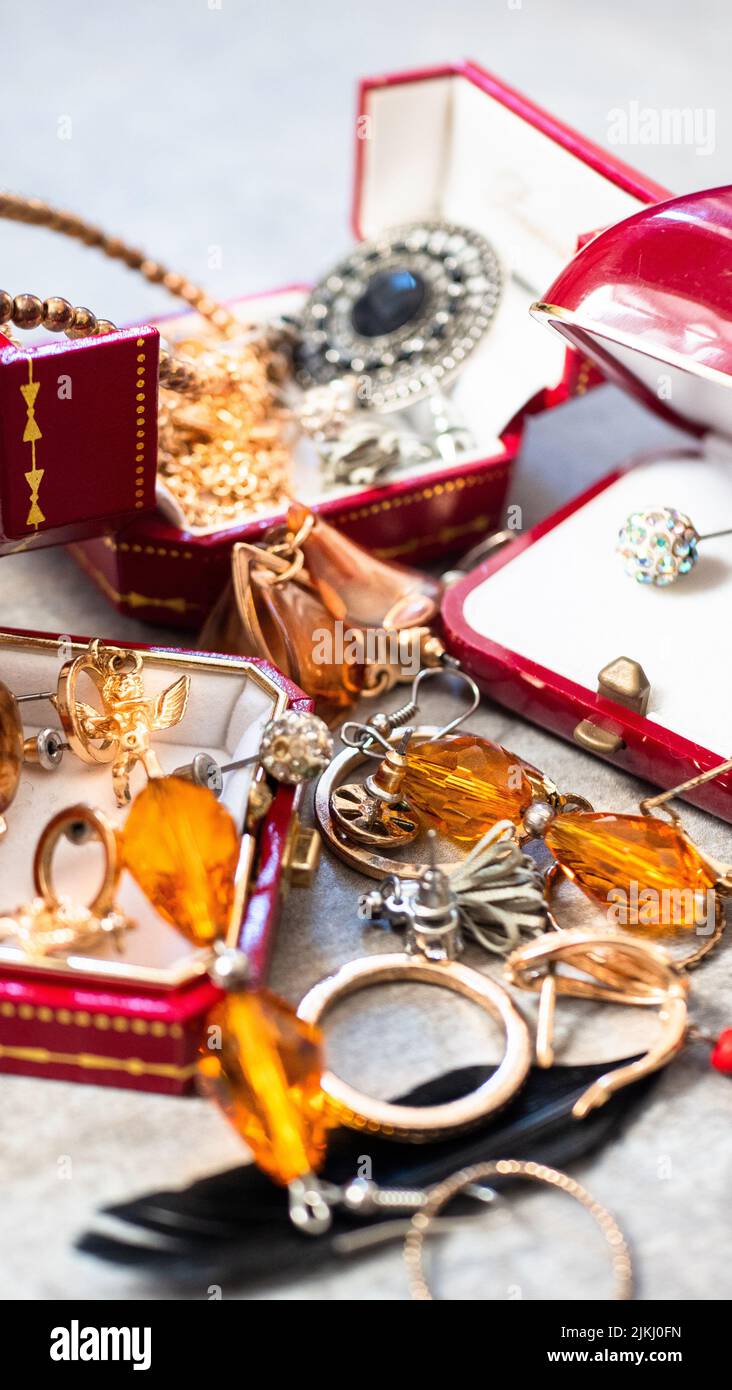Old red boxes full of jewelry. Treasure chest, close up Stock Photo - Alamy