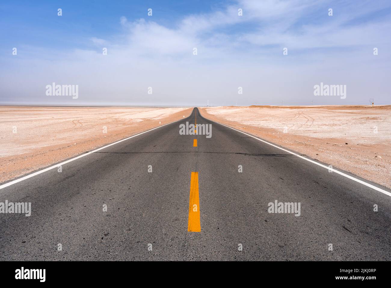 An empty endless road through the desert Stock Photo - Alamy