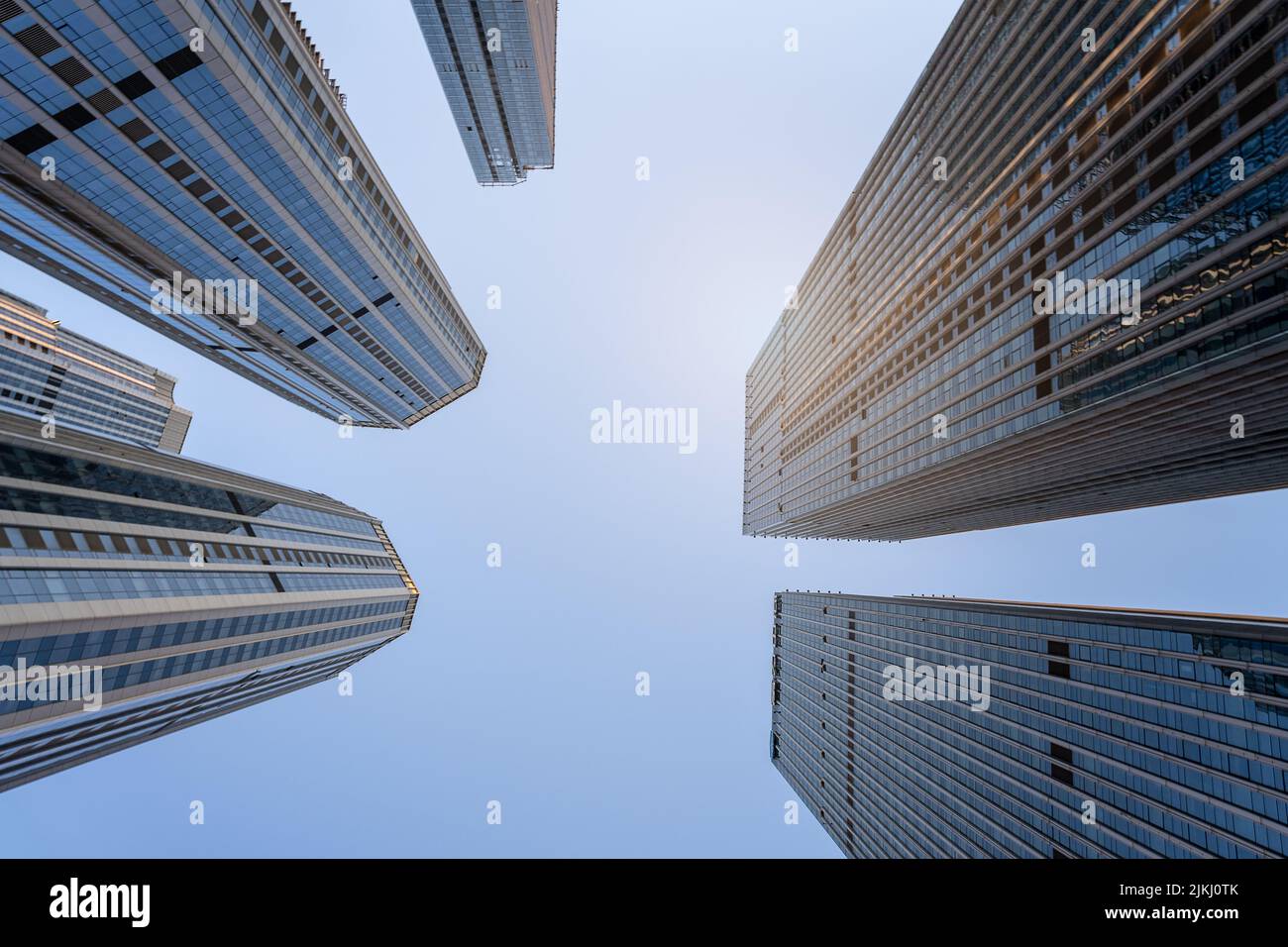 A low angle view of tall modern buildings under the blue sky Stock ...