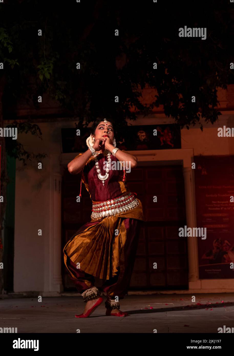 A photo of a young Indian female artist performing Indian classical ...