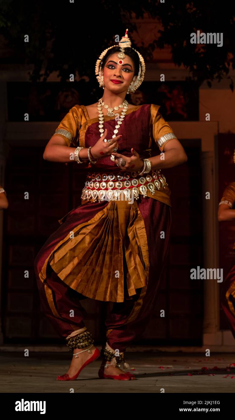 A photo of a young Indian female artist performing Indian classical ...