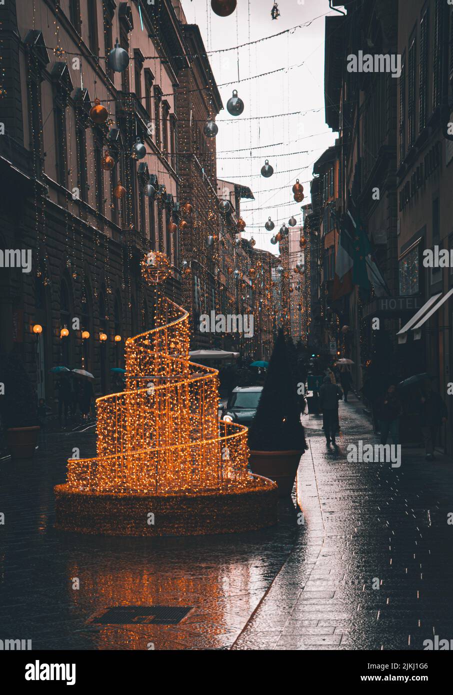 A vertical wide angle shot of Florence street with holiday decorations ...
