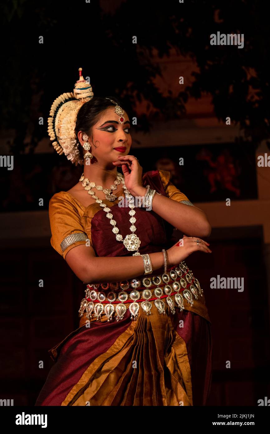 A photo of a young Indian female artist performing Indian classical ...