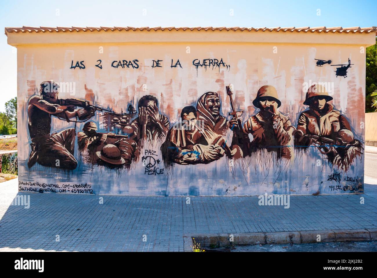 An art painted of soldiers and civilians like war on a Building's Wall ...