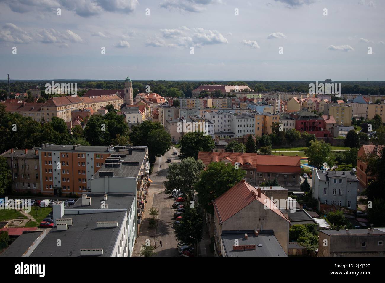 An aerial view of colorful residential buildings and trees under the ...