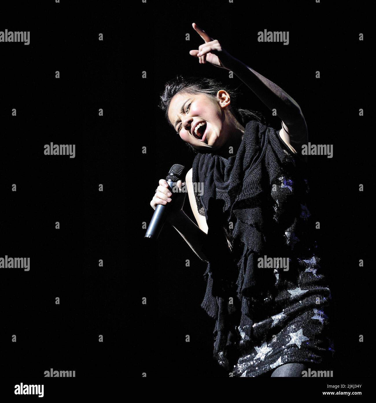 The G.E.M. singer performing on the stage in Toronto for charity ...