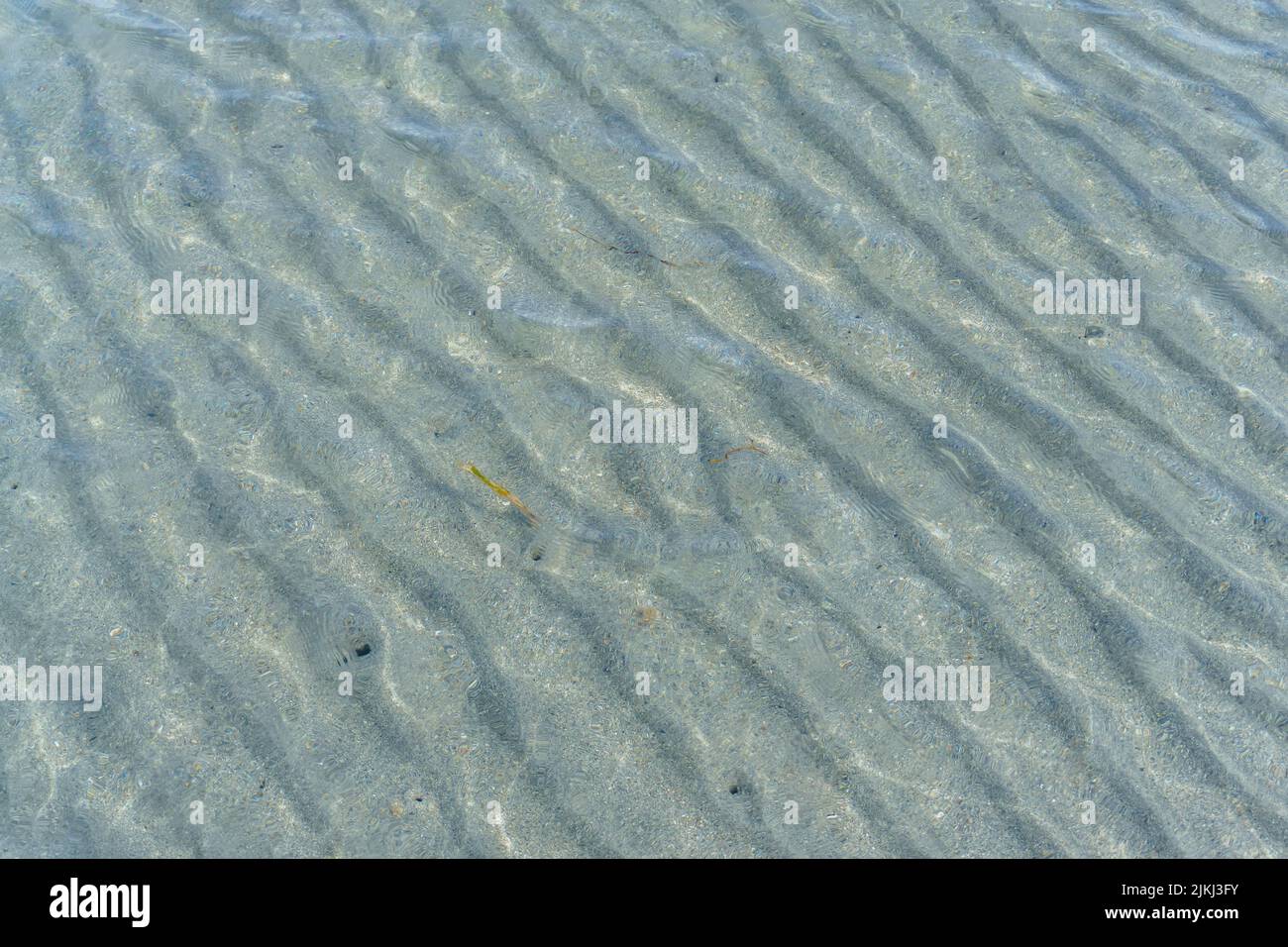A beautiful view of the wavy calm ocean on the coast Stock Photo - Alamy
