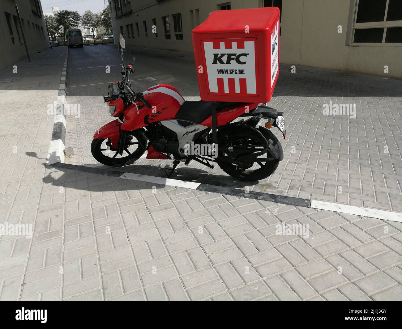 A KFC food delivery bike painted in KFC colors in Dubai, UAE Stock ...
