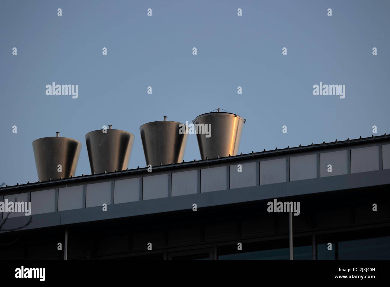 a low angle shot of metal containers on roof Stock Photo - Alamy