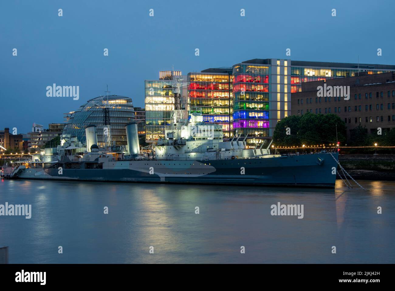 HMS Belfast, museum ship at Tower Bridge, office building behind ...