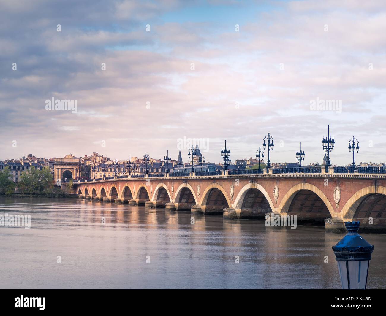 Stone bridge over the Garonne River in Bordeaux with the Gourgogne gate ...