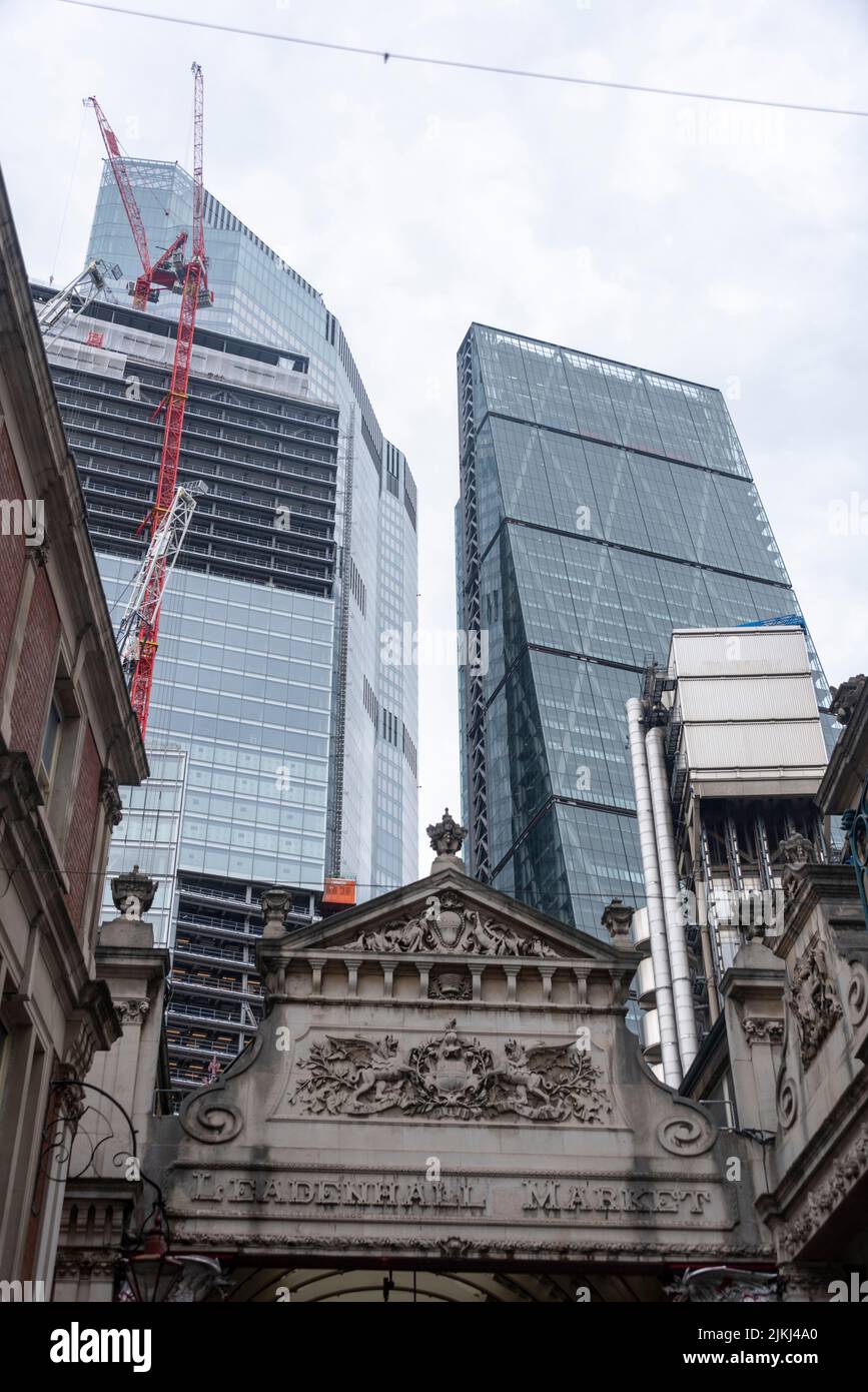 Leadenhall Market, historic market hall, behind it skyscrapers of the ...