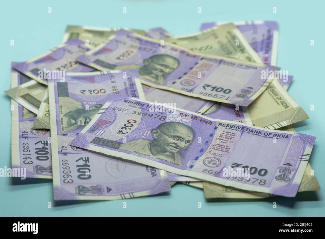 The Indian currency - 500 rupee notes and 100 rupee notes on the blue ...
