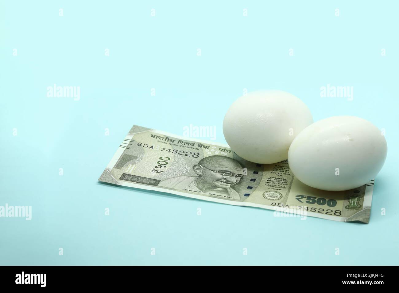The Indian currency - 500 rupee note with eggs on the blue background ...