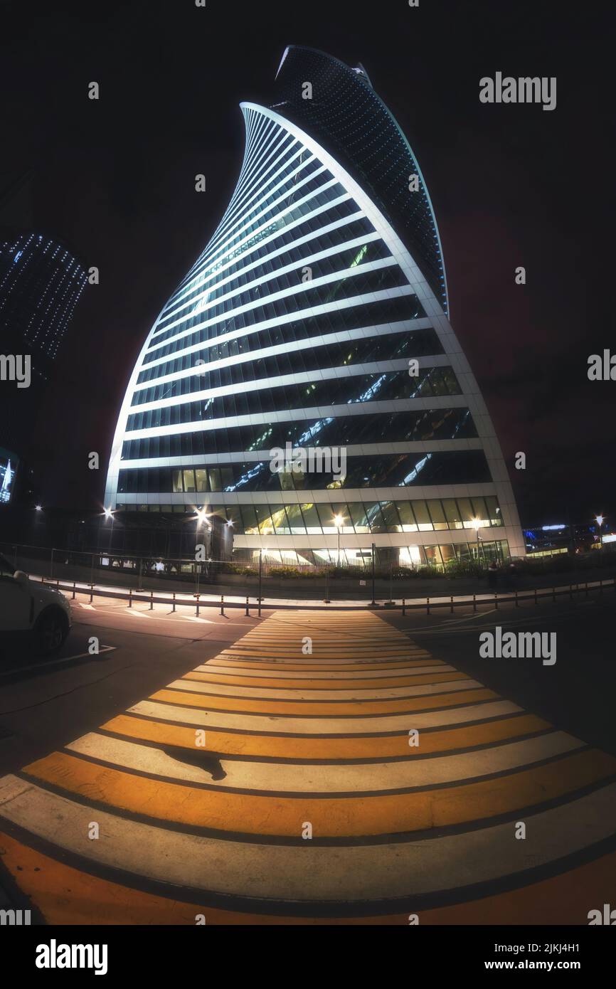 a vertical shot of crosswalk leads to the Evolution Tower skyscraper ...