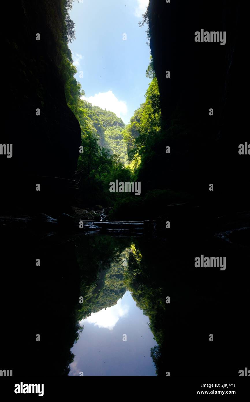 A Scenic view of the lake and green mountains with visible reflections ...