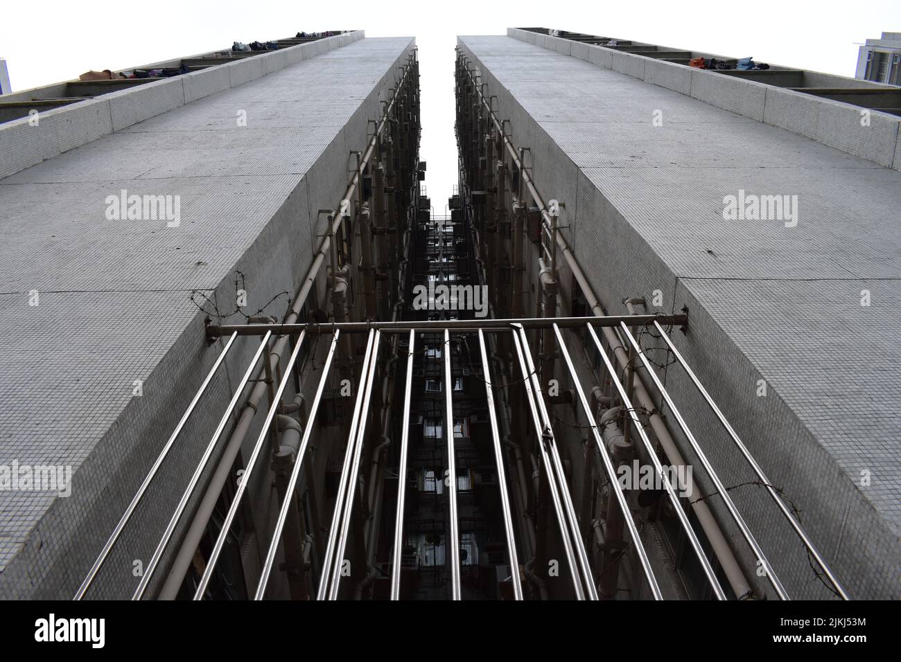 A low angle shot of the space between Two buildings in Kowloon district ... A low angle shot of the space between Two buildings in Kowloon district ...
