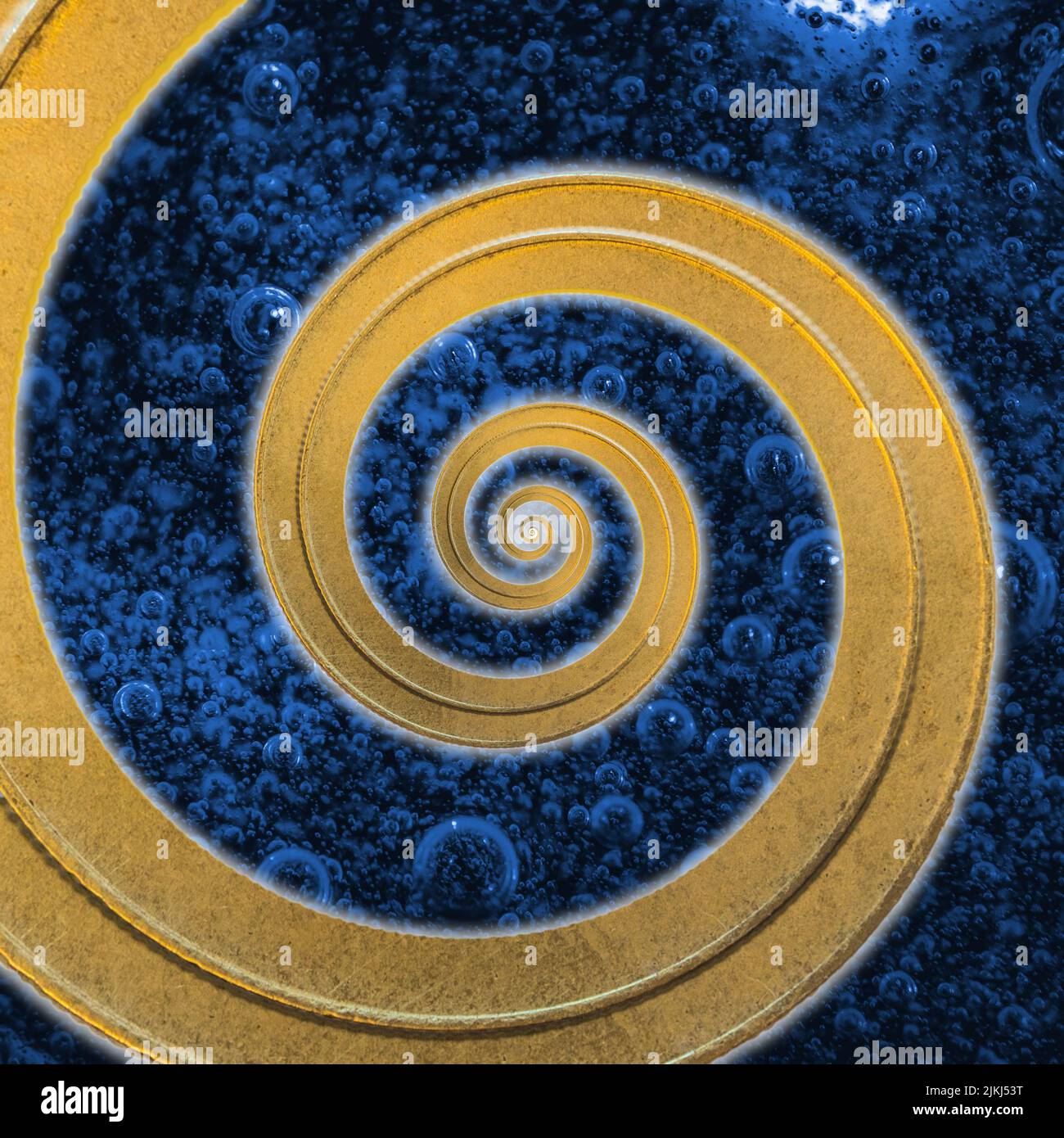 A blue and golden spiral effect Stock Photo - Alamy