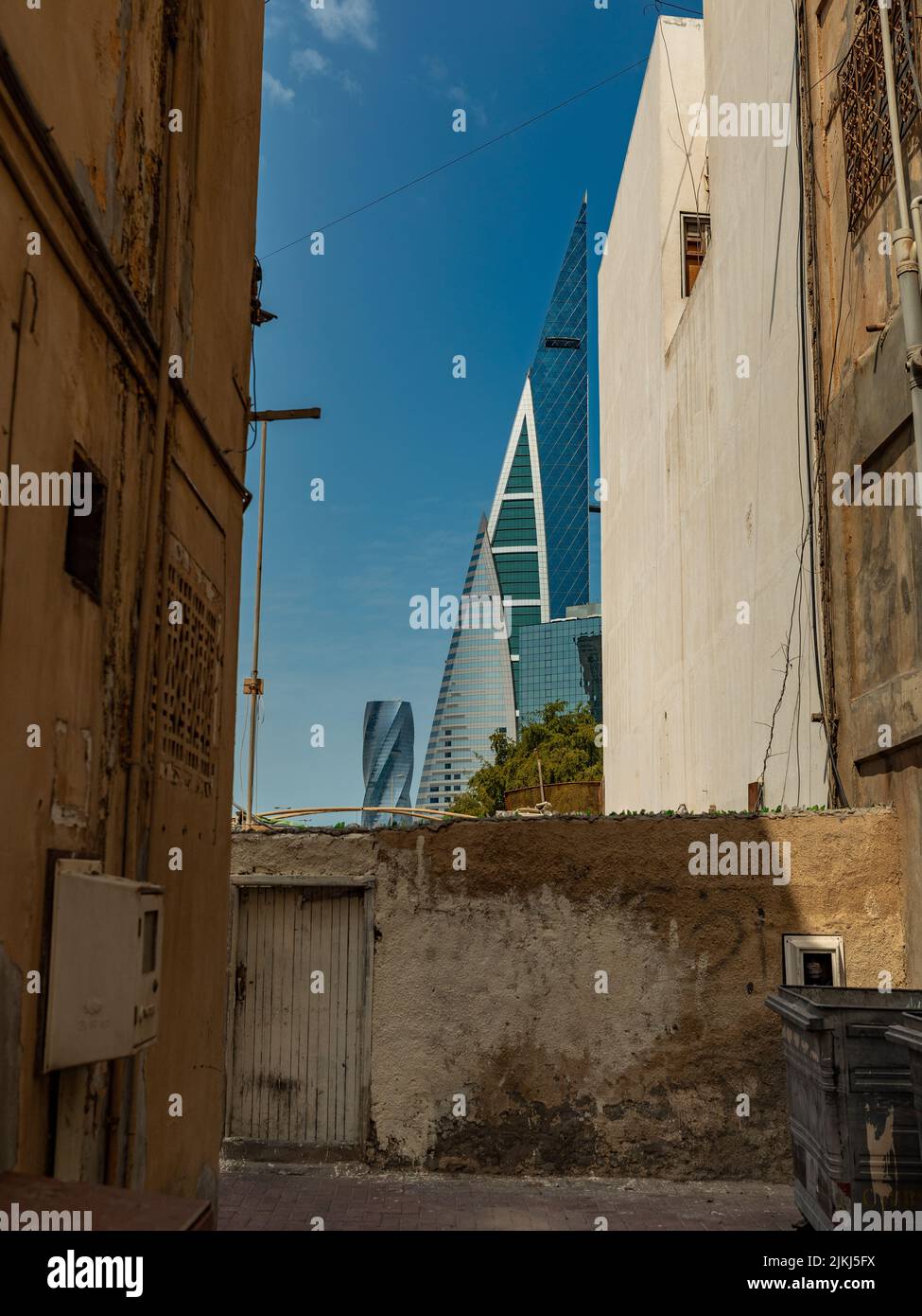 A vertical shot of buildings with blue sky in the middle Stock Photo ...