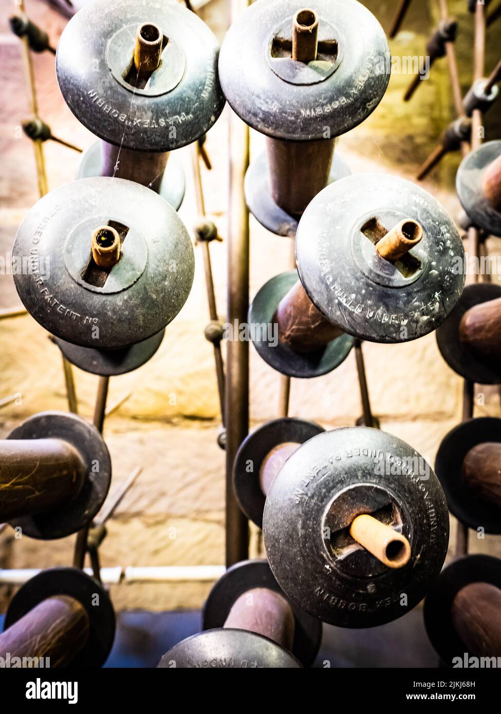 Empty historic industrial machine weaving bobbins at the Strutts North ...