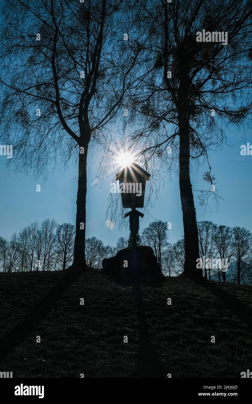 Crucifix, silhouette, backlight, sun, blue sky Stock Photo - Alamy