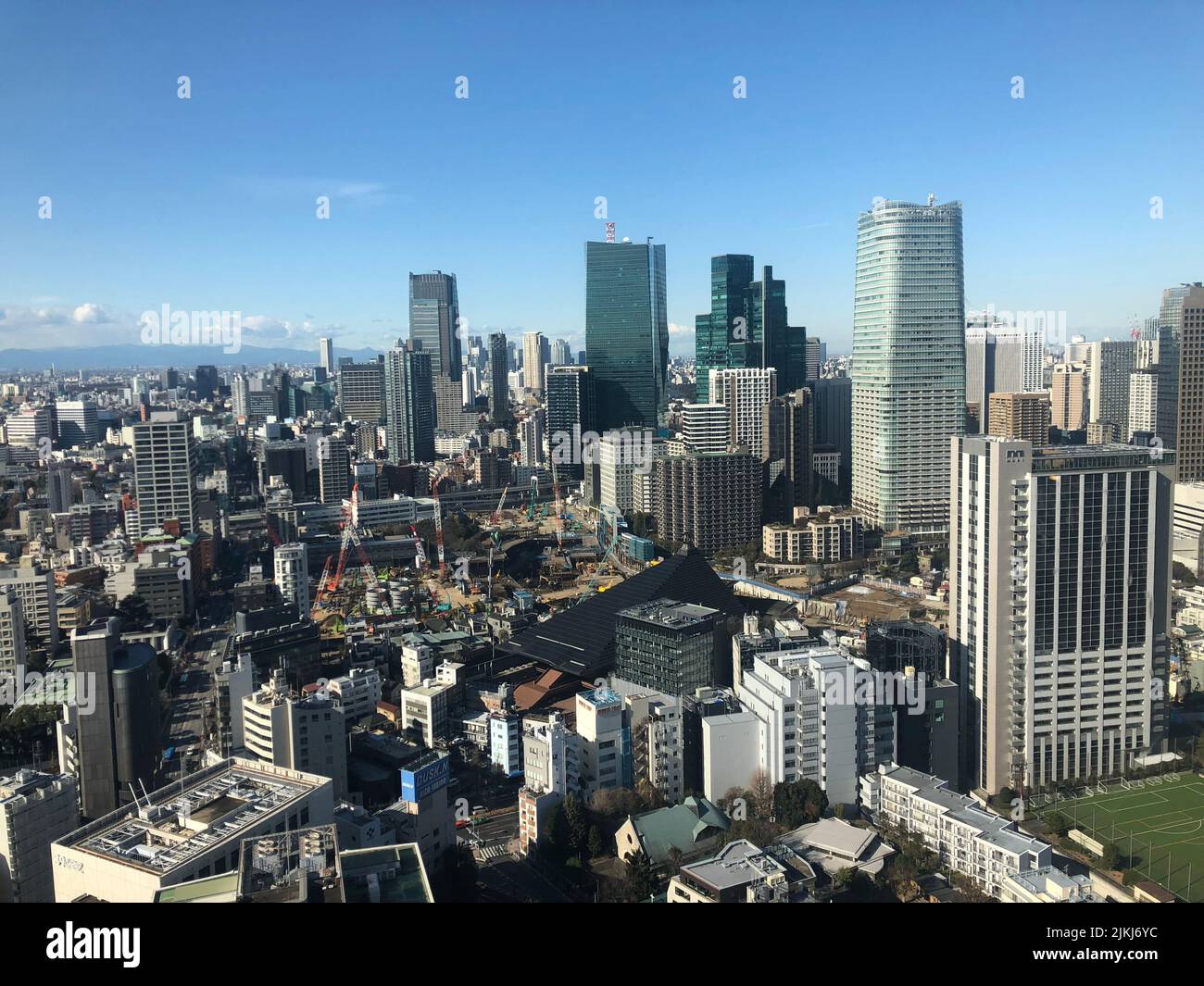 A bird's eye view of the modern skyscrapers of Tokyo, Japan under a ...