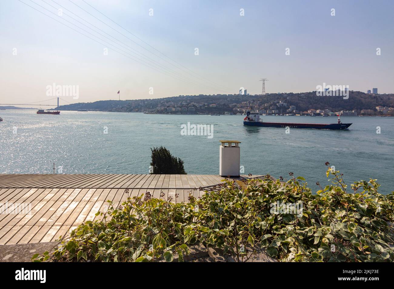 A cargo ship passing through the strait Stock Photo - Alamy