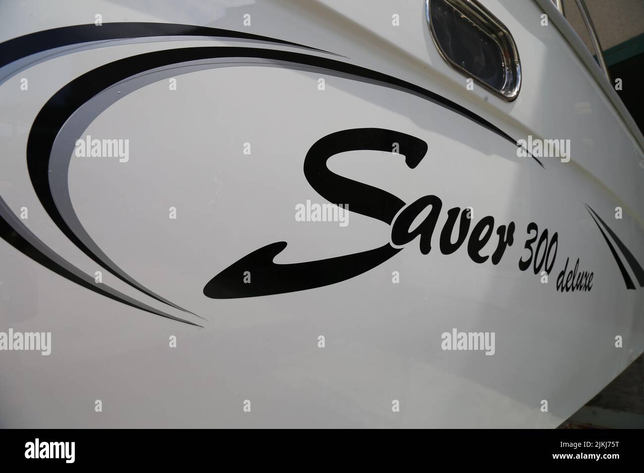 A closeup shot of the hull of the Saver 300 with the logo of the boat ...