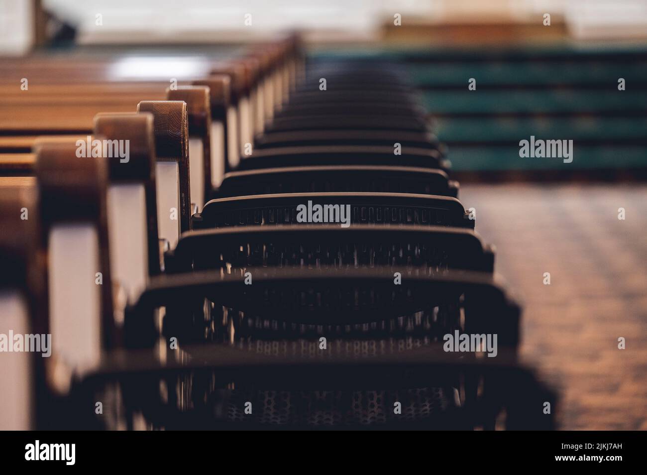 A row of wooden church pews Stock Photo - Alamy