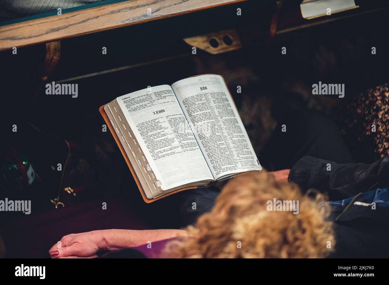 A closeup shot of an open Bible in church Stock Photo - Alamy