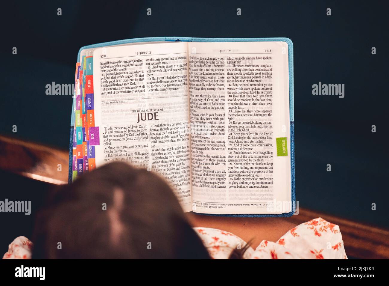 A top view of a colorful open Bible with Jude's book Stock Photo - Alamy