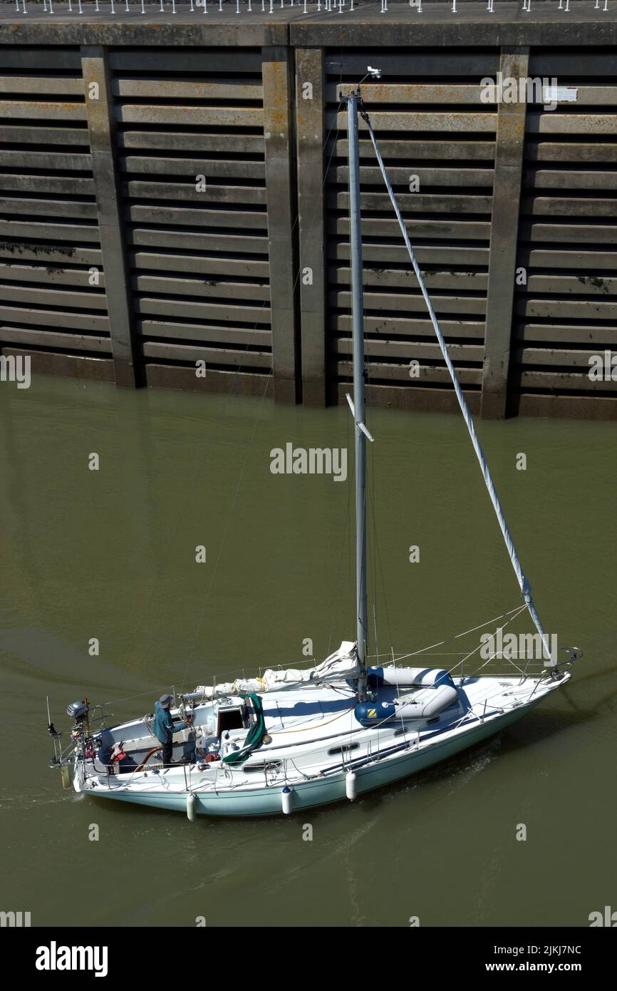 Yacht approaching sea lock on Cardiff Bay Barrage, South Wales, UK ...