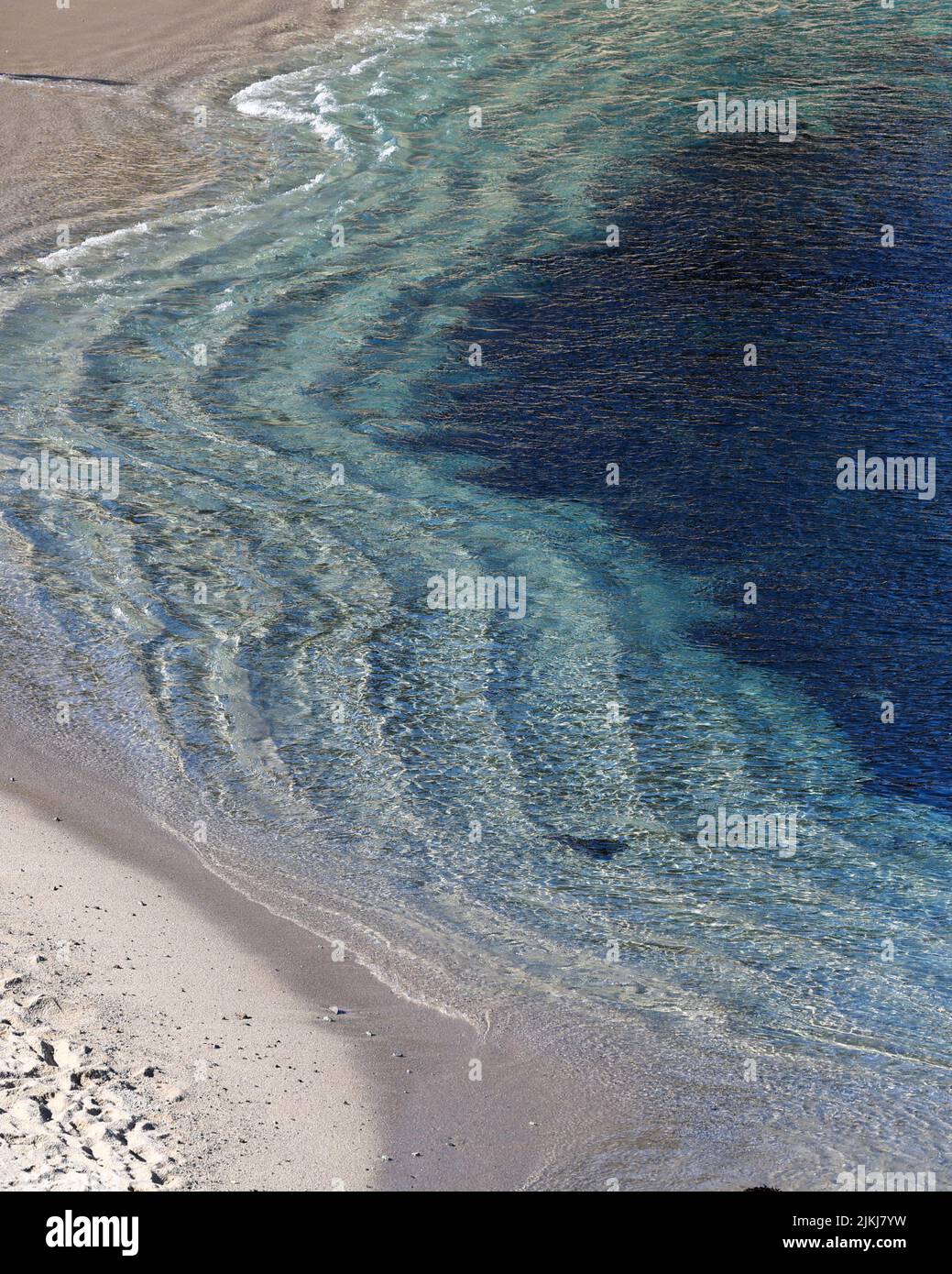 A beautiful view of an ocean near a sandy coast Stock Photo - Alamy