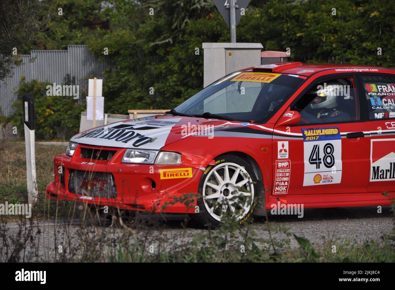 A red Mitsubishi Lancer vintage car rally in race Stock Photo - Alamy