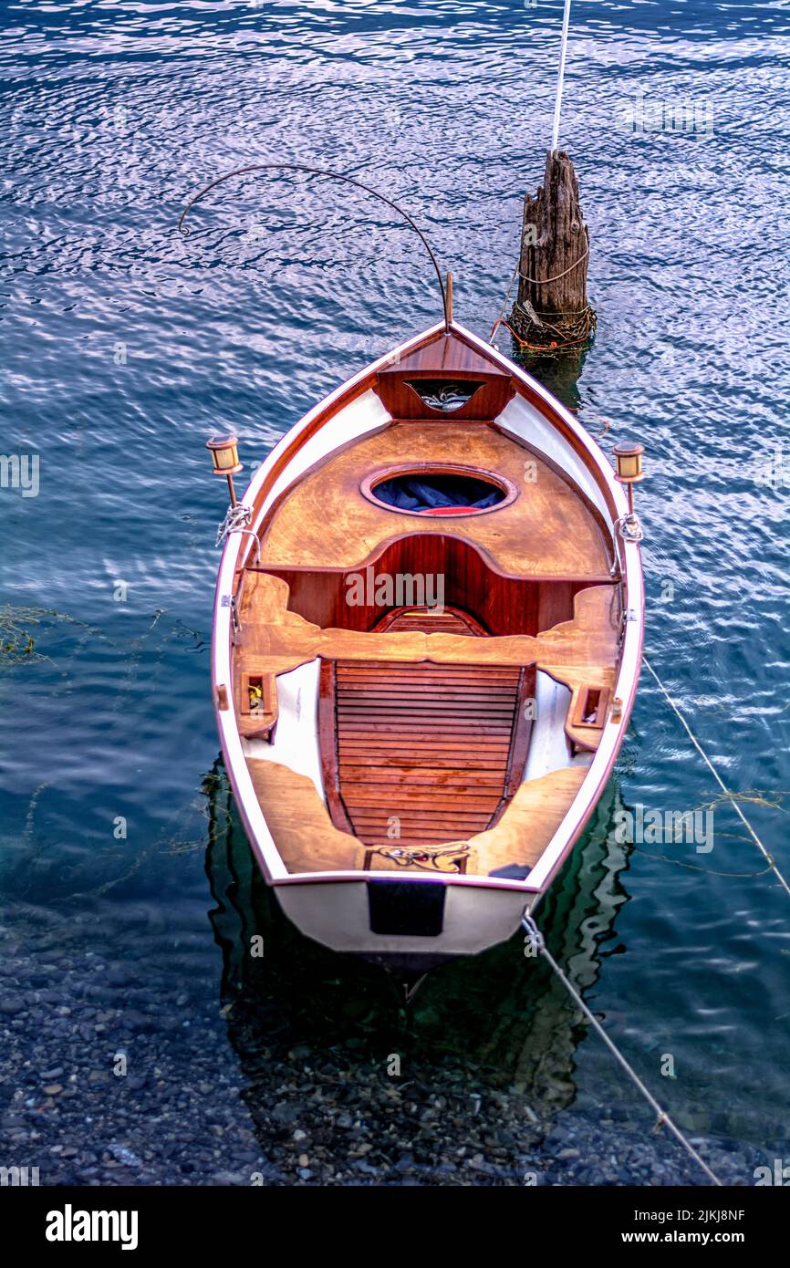 A beautiful shot of a boat moored to a dock on a sunny day Stock Photo ...
