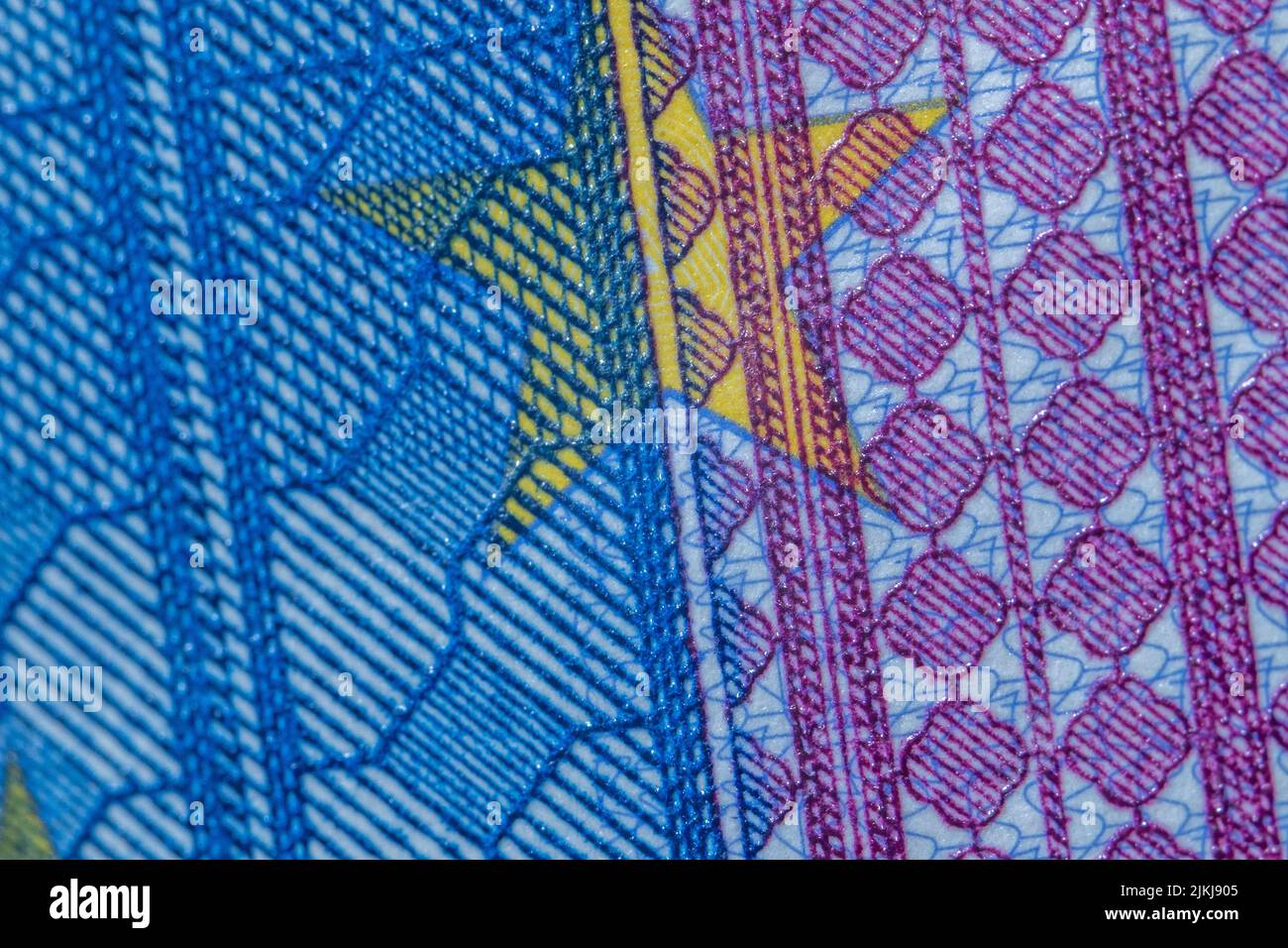 A macro focus shot of the blue and purple detail on the twenty euro ...