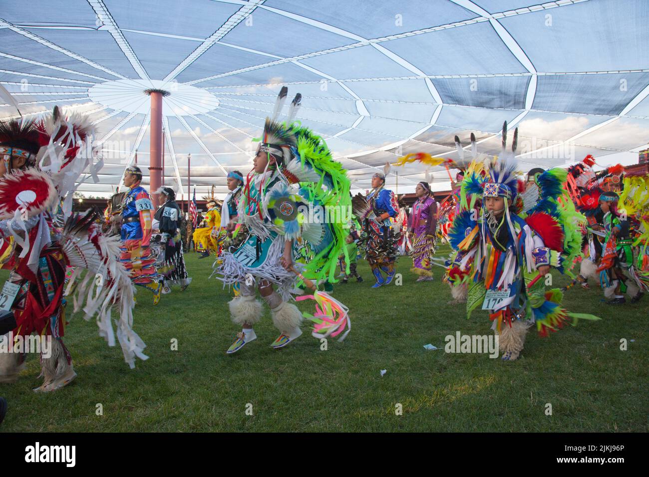 Group of boy's traditional fancy dancers dressed in colorful regalia ...