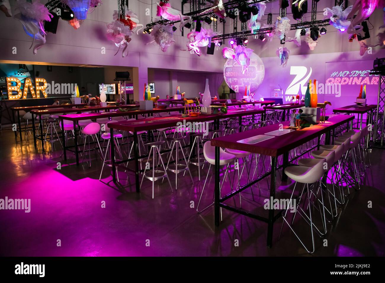 A purple interior design for an indoor media party event Stock Photo ...