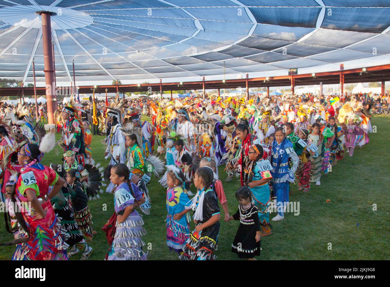 Group of young girls dressed in jingle dance dresses during the ...