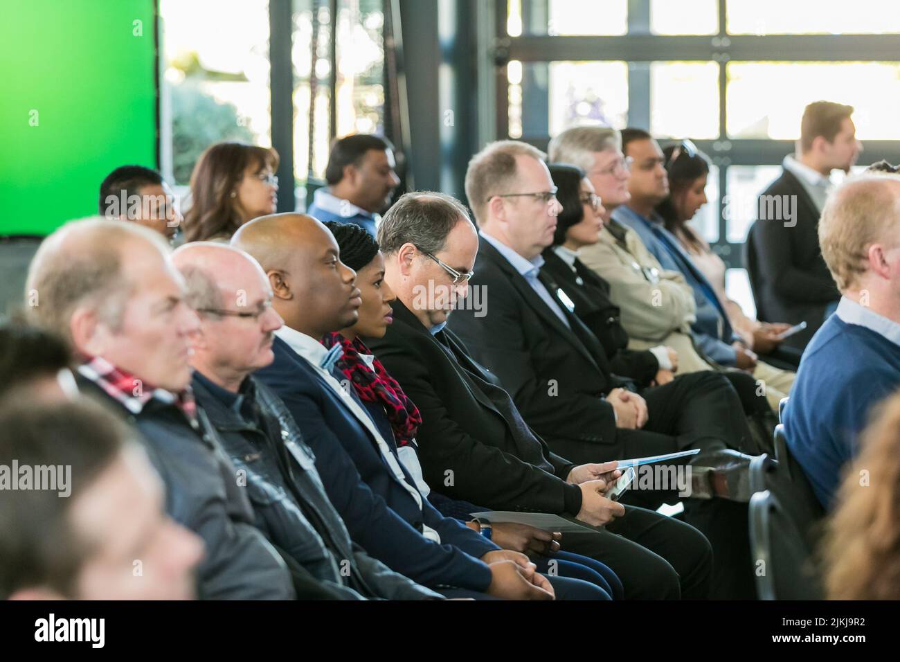 A group of people attending a business conference Stock Photo - Alamy